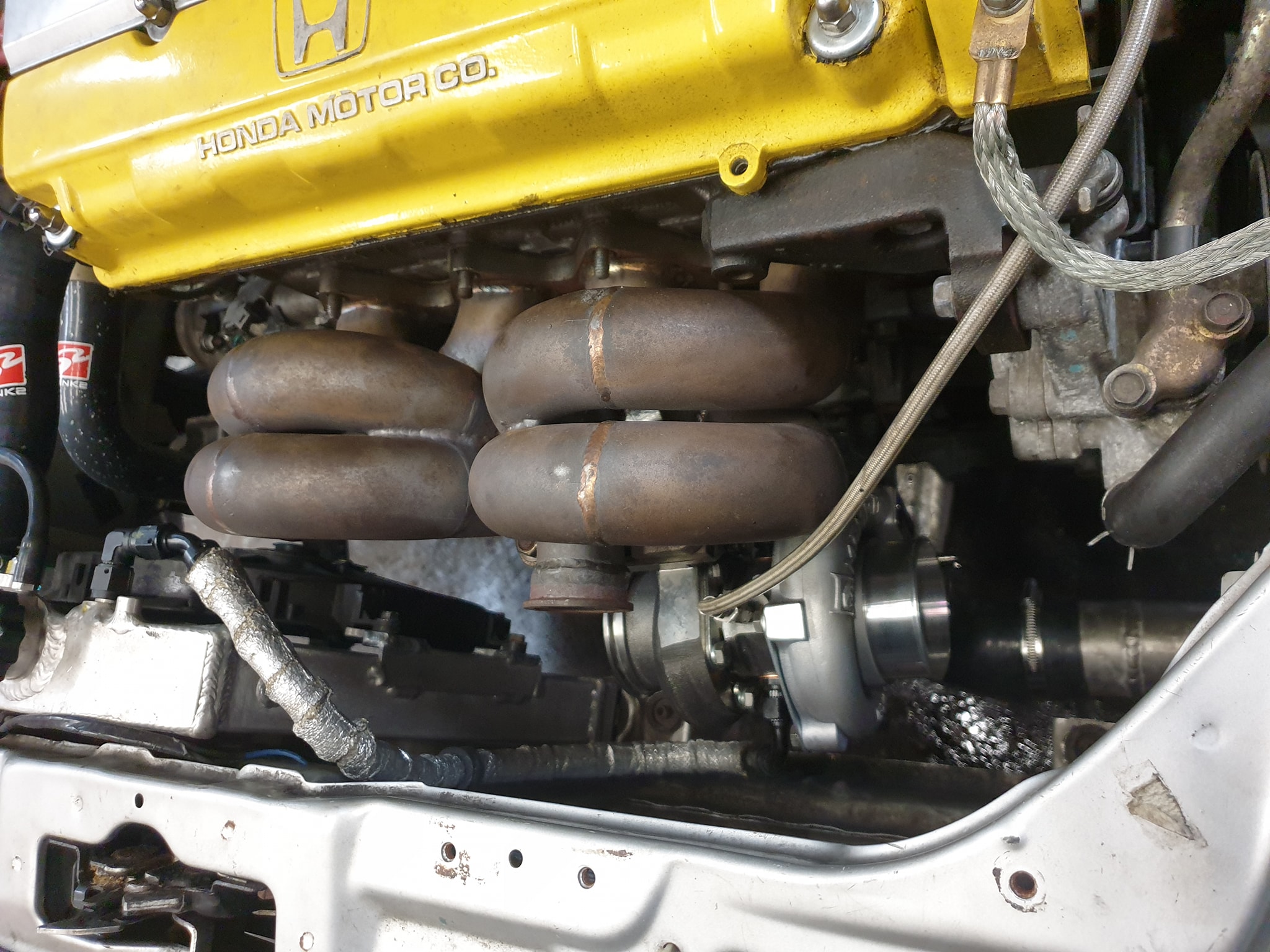 Ryan's honda civic em1 coupe in for a new turbo and custom 3" downpipe ...